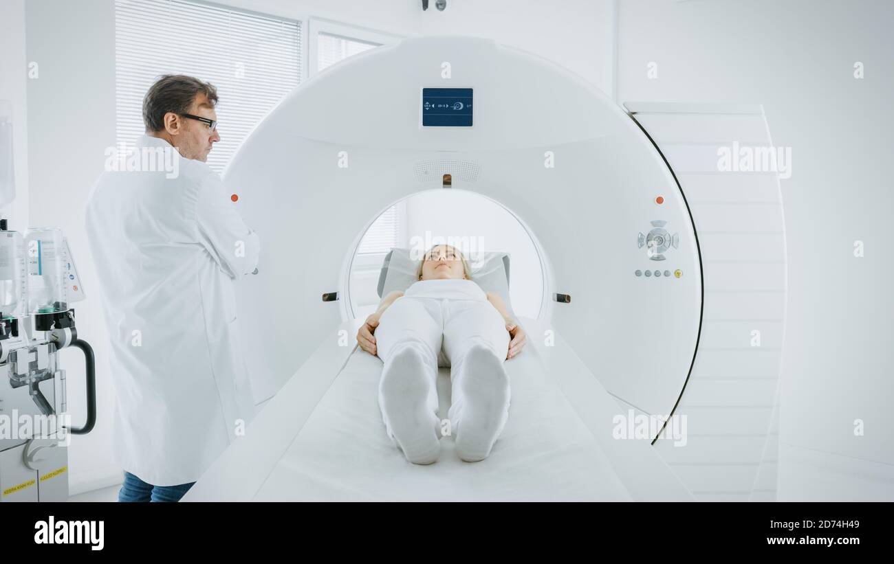 In Medical Laboratory Male Radiologist Controls MRI or CT or PET Scan ...