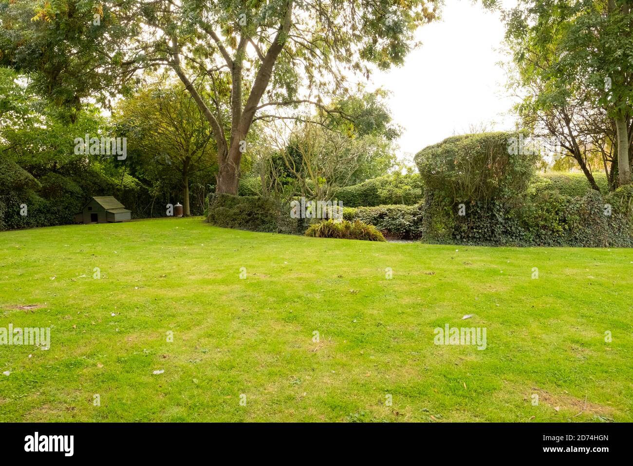 Well-maintained lawn and private gardens seen after the large lawn area ...