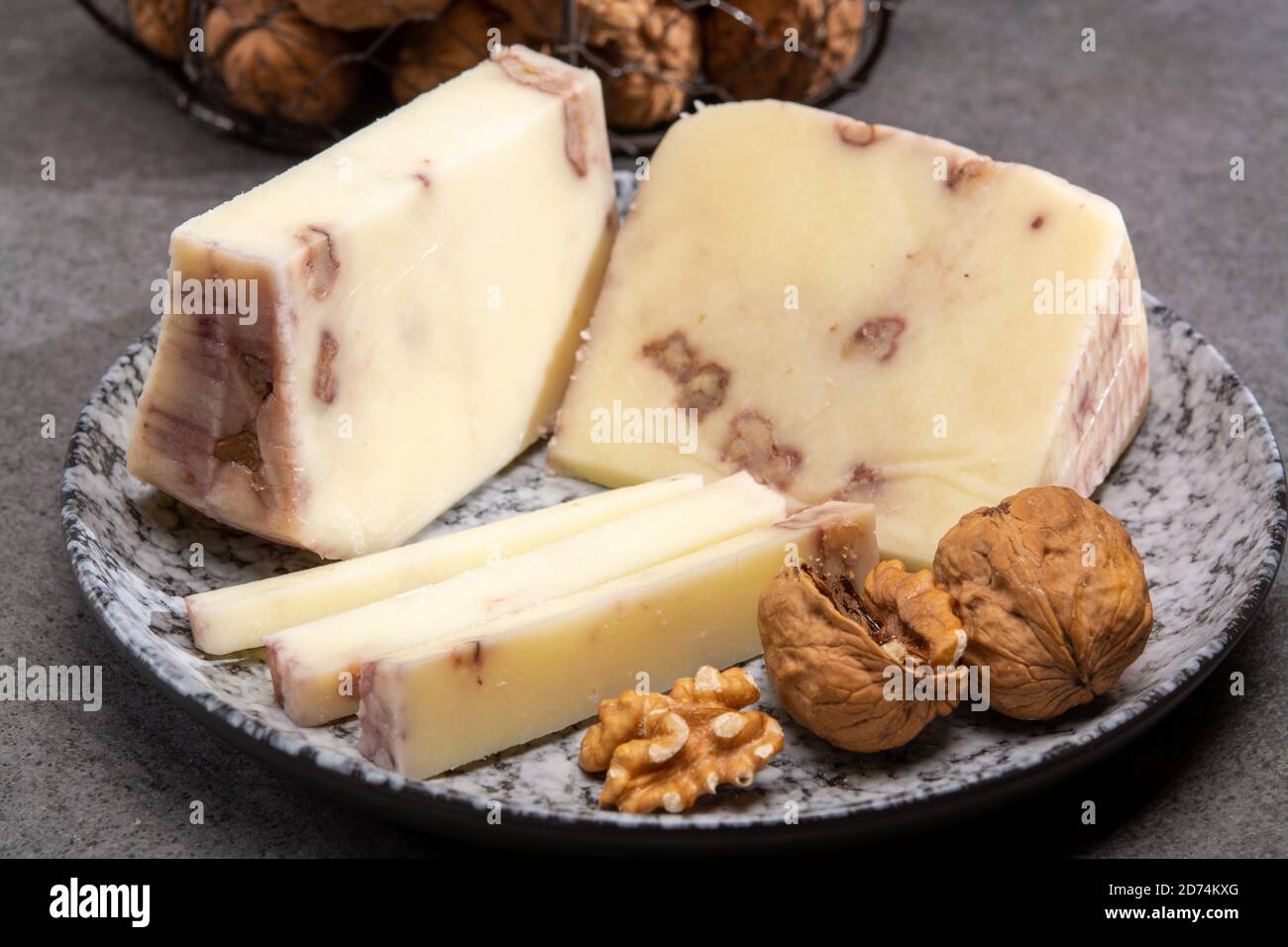 Cheese collection, Italian provolone cheese made with walnuts close up ...