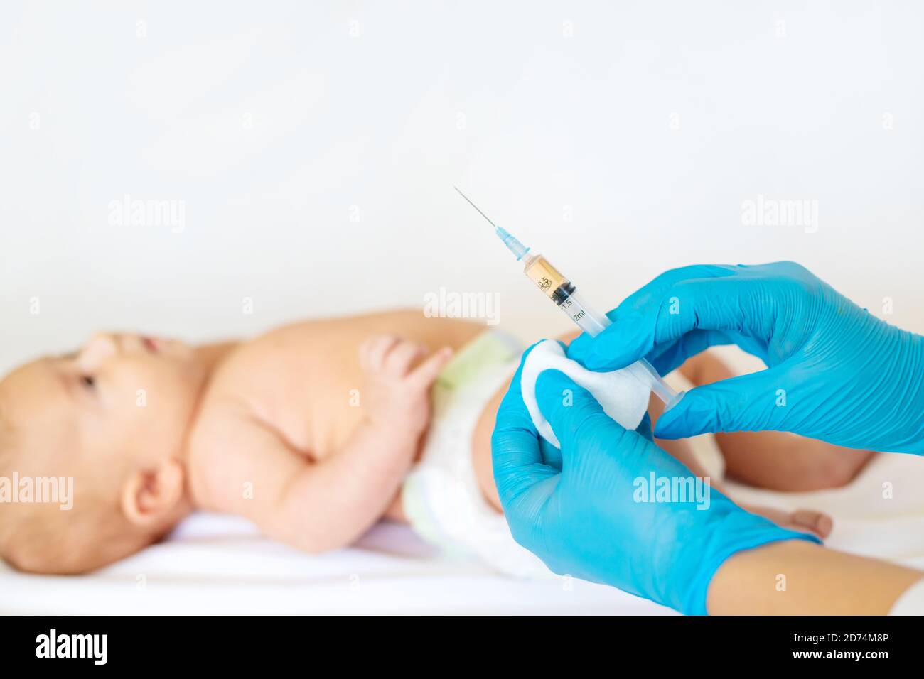 Vaccination baby, injection in the leg. Selective focus. people Stock ...