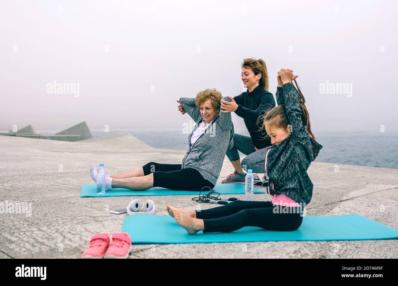Three female generations exercising Stock Photo - Alamy