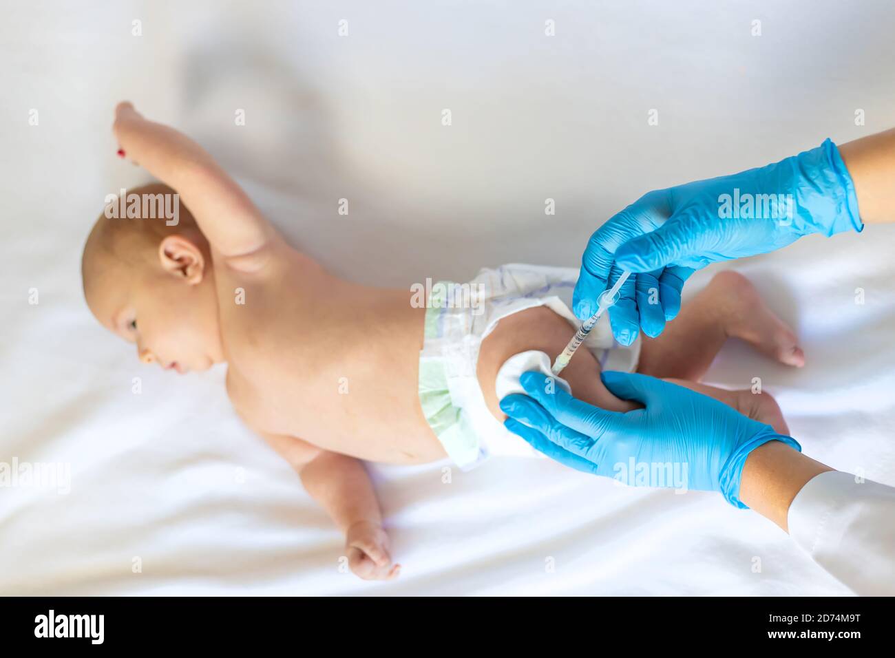 Vaccination baby, injection in the leg. Selective focus. people Stock ...