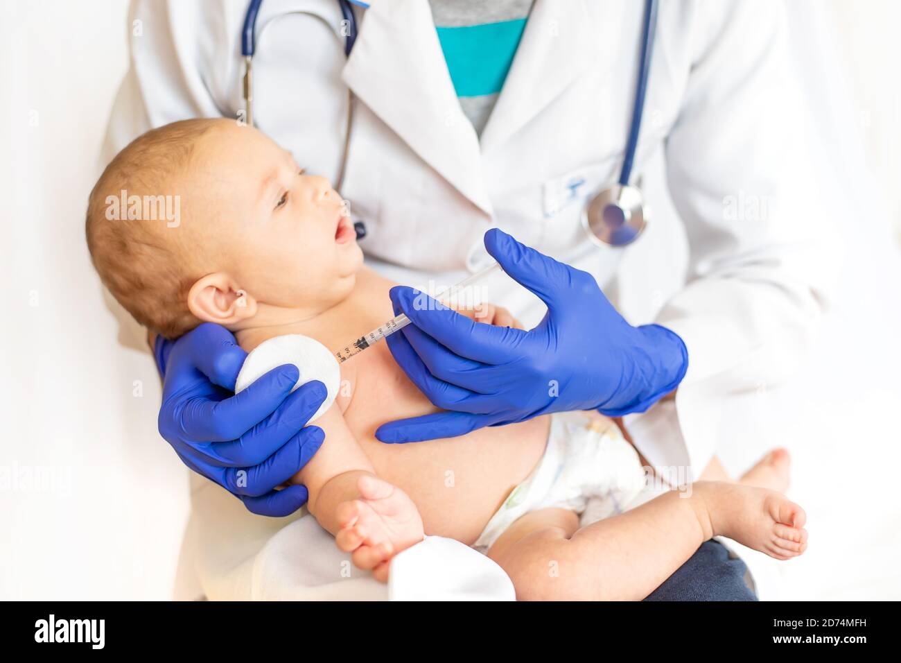 Vaccination baby, injection in the arm. Selective focus. People Stock ...
