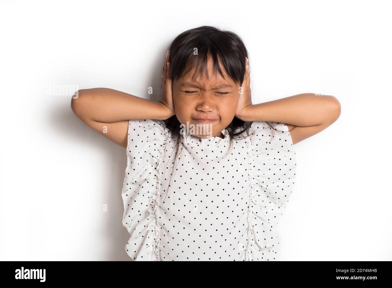 Asian little girl close her ears and close the eyes Stock Photo - Alamy