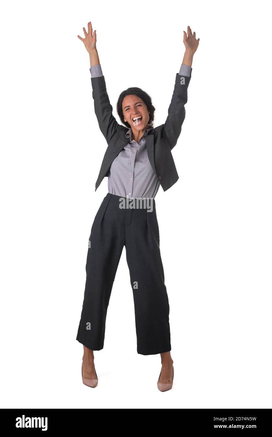 Young business woman winner with arms raised isolated on white ...
