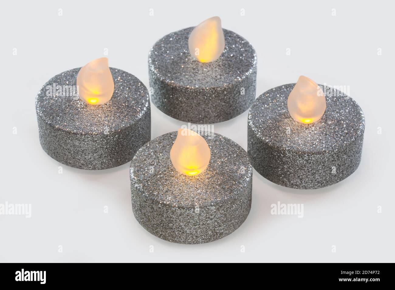 Four silver LED candles set Stock Photo - Alamy