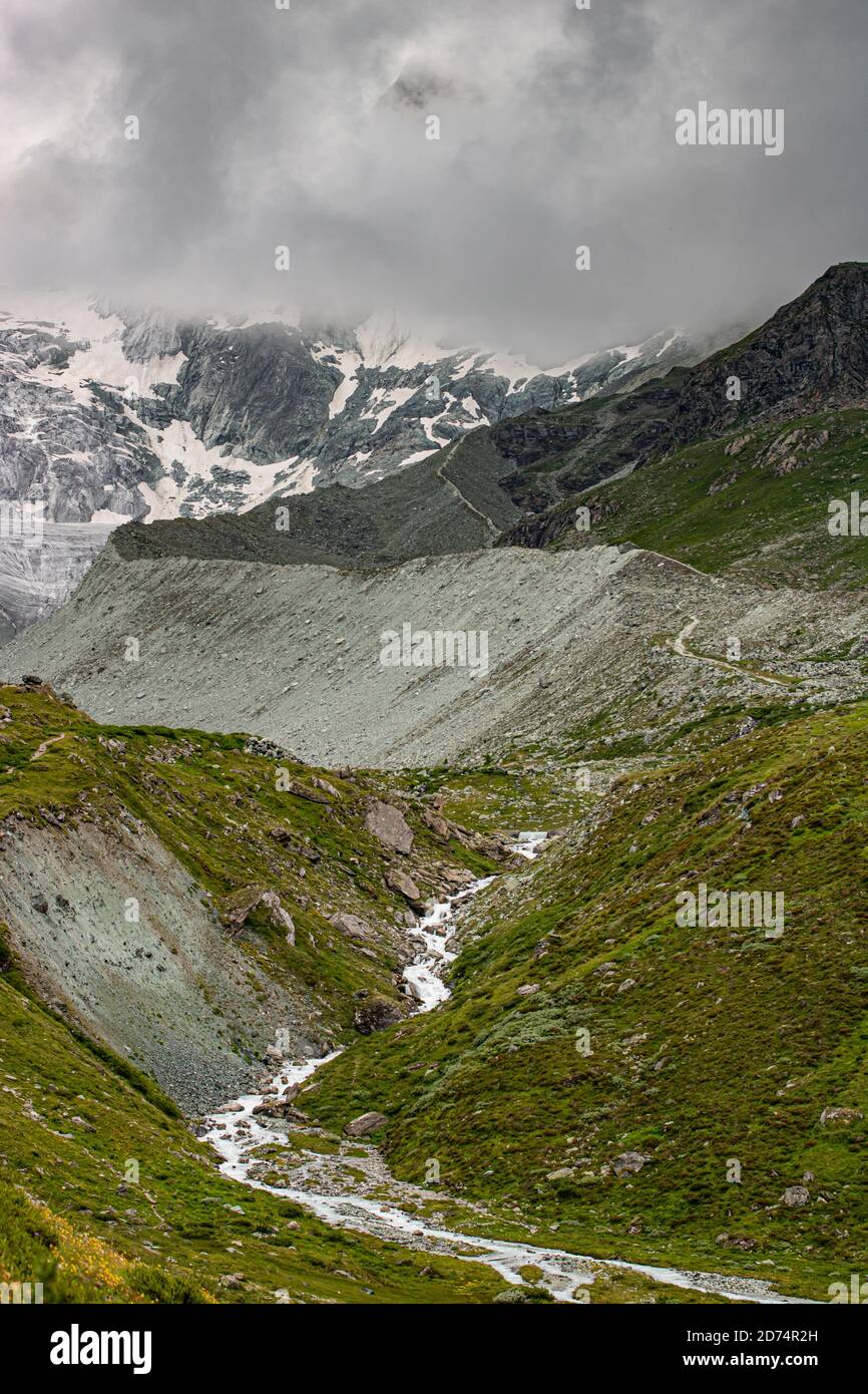 Aerial view of mountainscape below Lac de Moiry in the Swiss Alps. CH ...