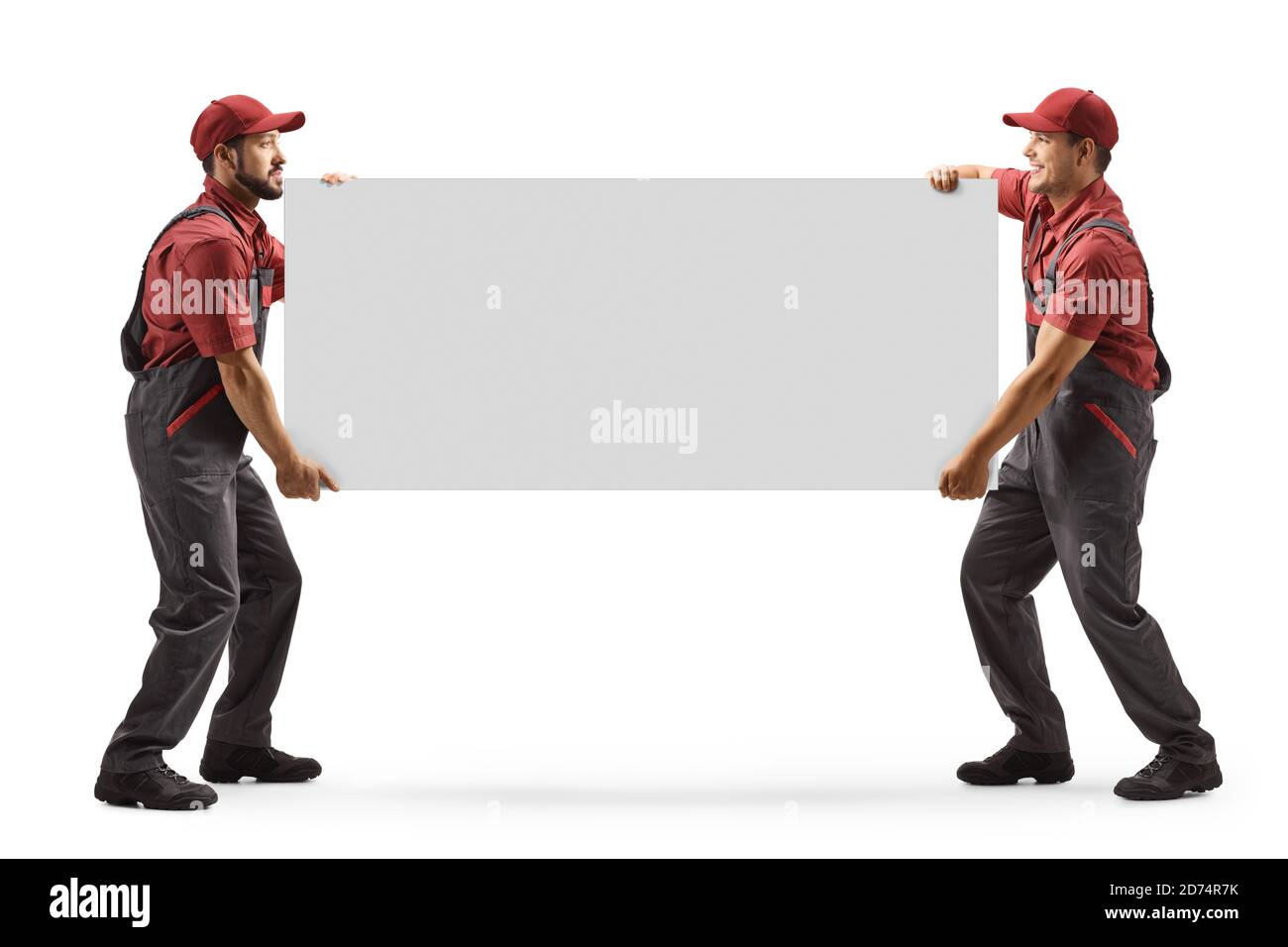 Workers carrying blank panel Stock Photo - Alamy
