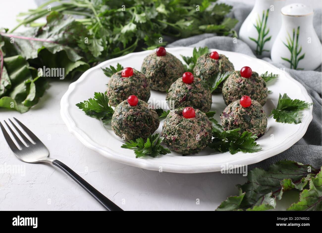 Traditional Georgian appetizer pkhali from beet tops on light gray ...