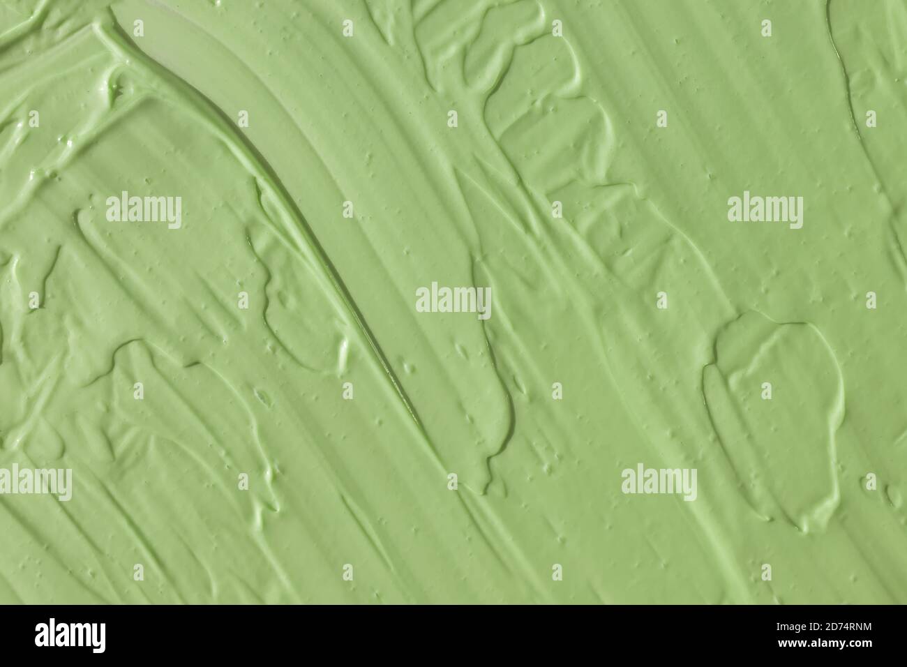 Green cosmetic clay texture close up. Abstract background with brush ...