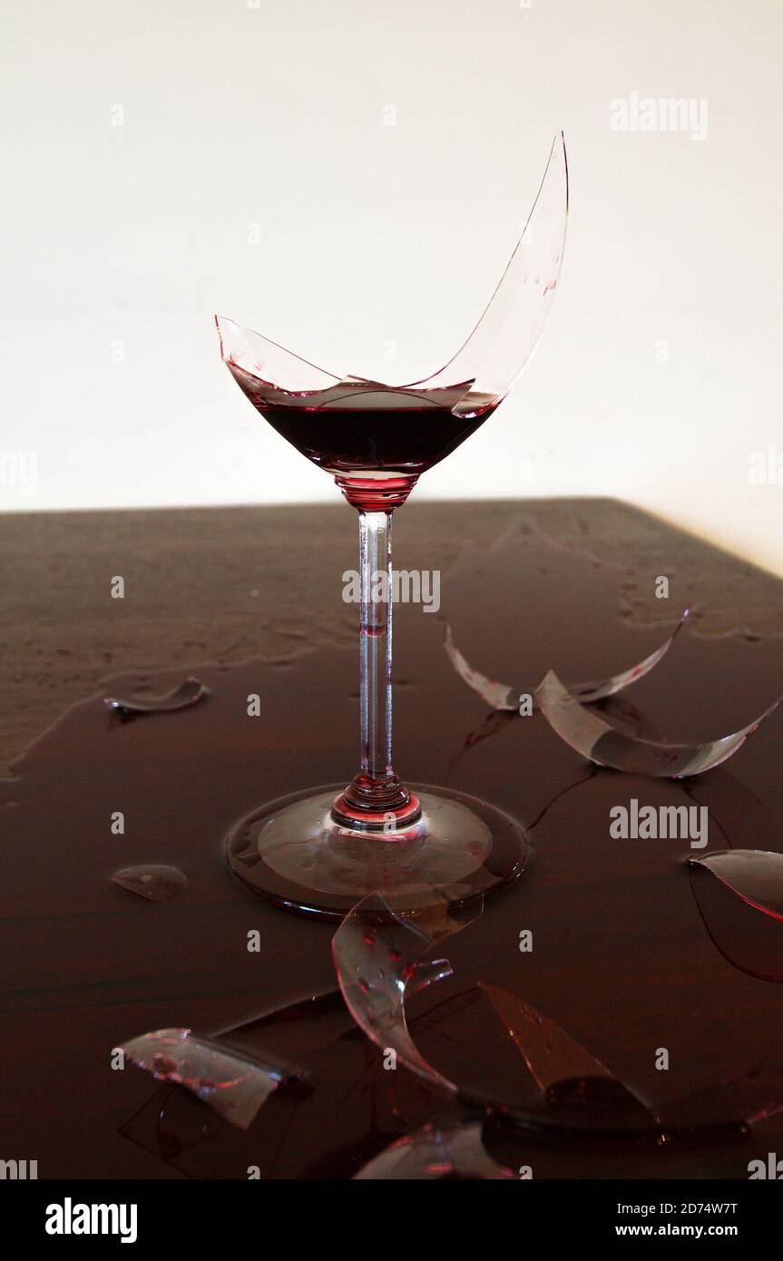 Vertical shot of a broken wine glass Stock Photo - Alamy