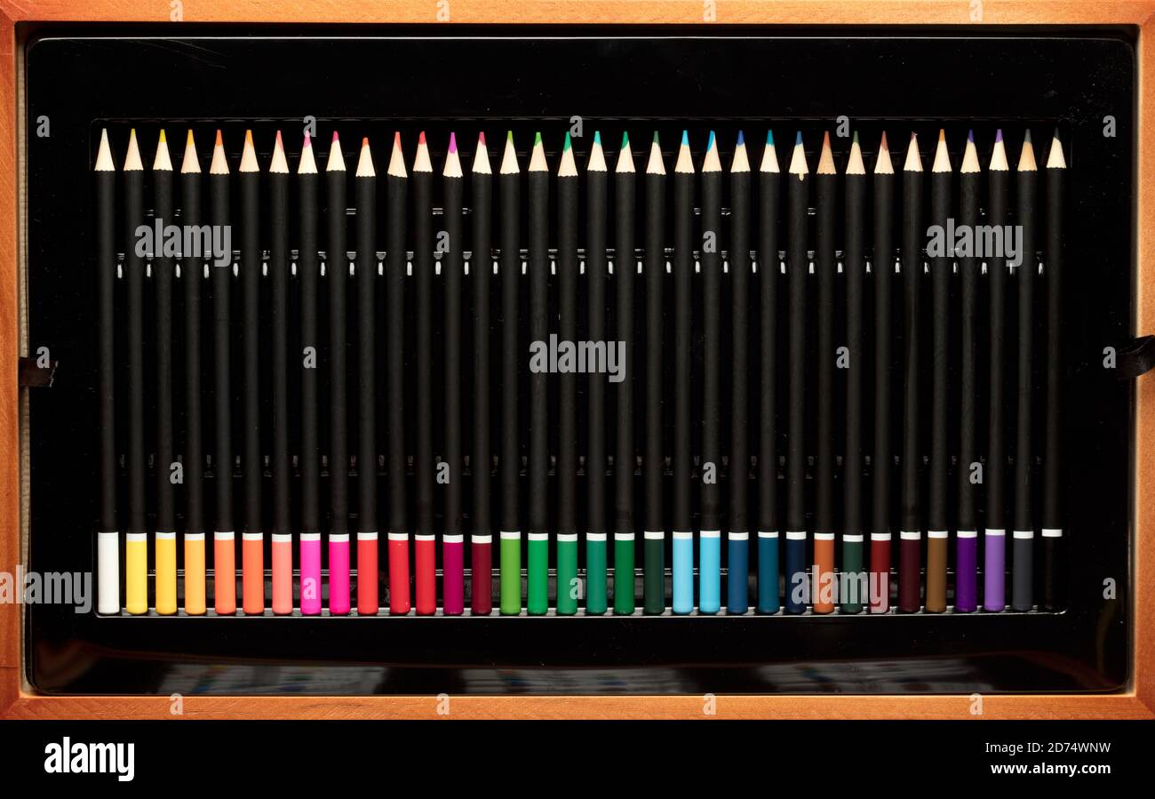 Colored pencils with wooden frame Stock Photo - Alamy