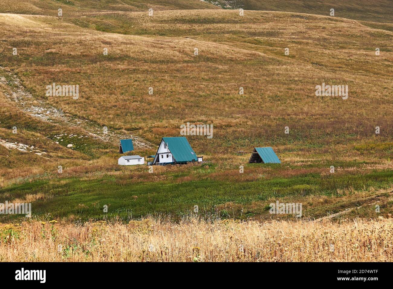 alpine tourist shelter in the autumn mountains against the background ...