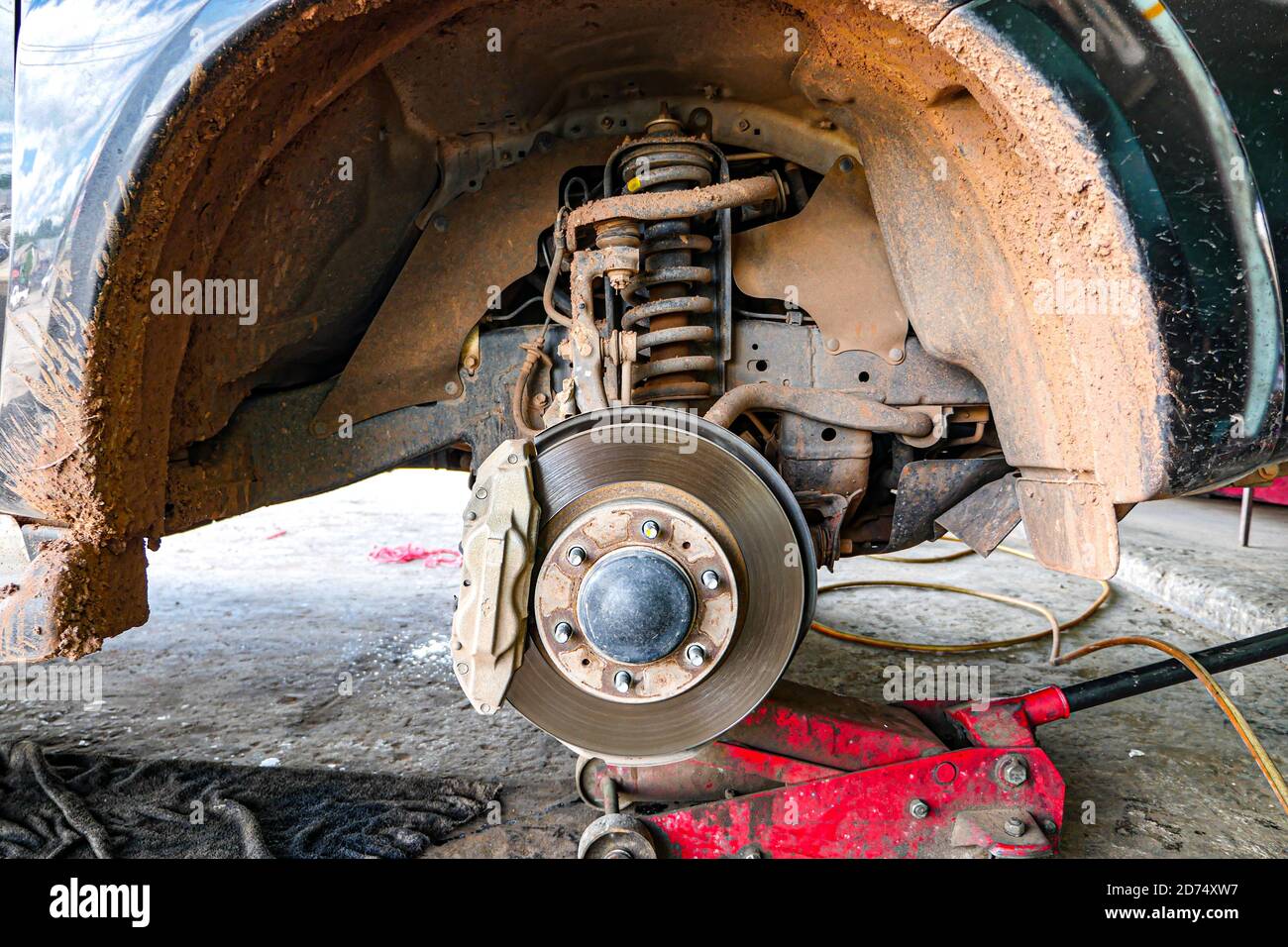 Closeup of car disc brake at Garage Stock Photo - Alamy