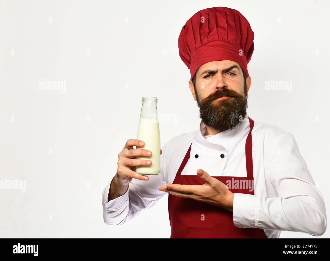 Homemade food concept. Cook with proud face in burgundy uniform has ...