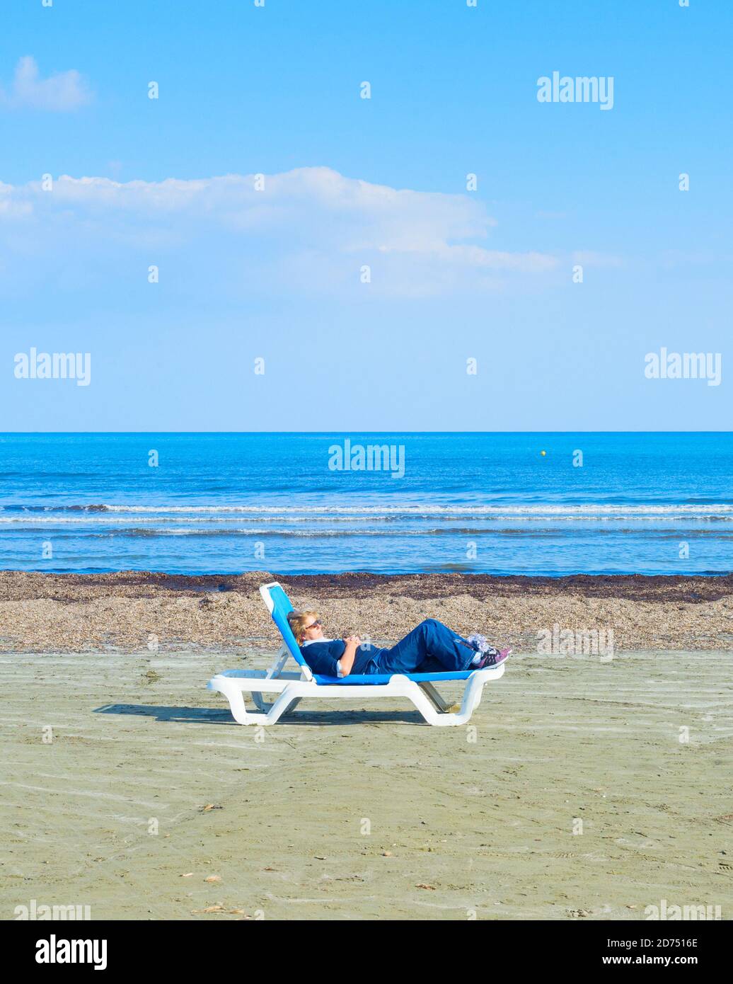 Mature woman deserted beach hi-res stock photography and images - Alamy