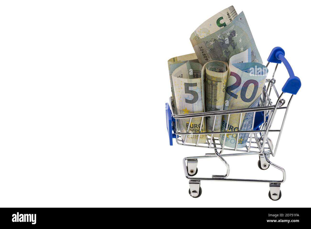 Close up macro view of shopping cart filled with rolled euro banknotes ...