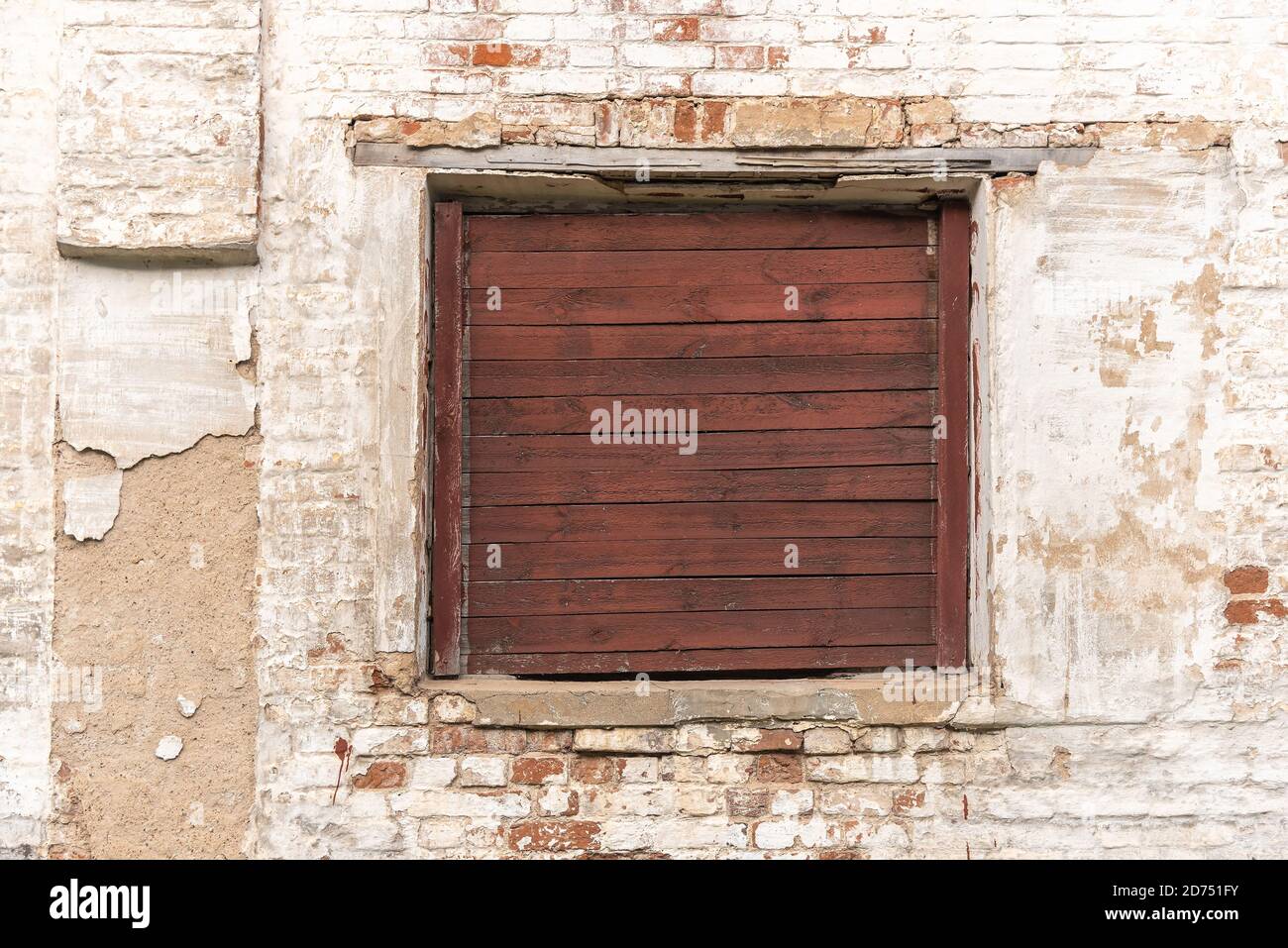 Old window with wooden shatter on wall of abandoned building Stock ...