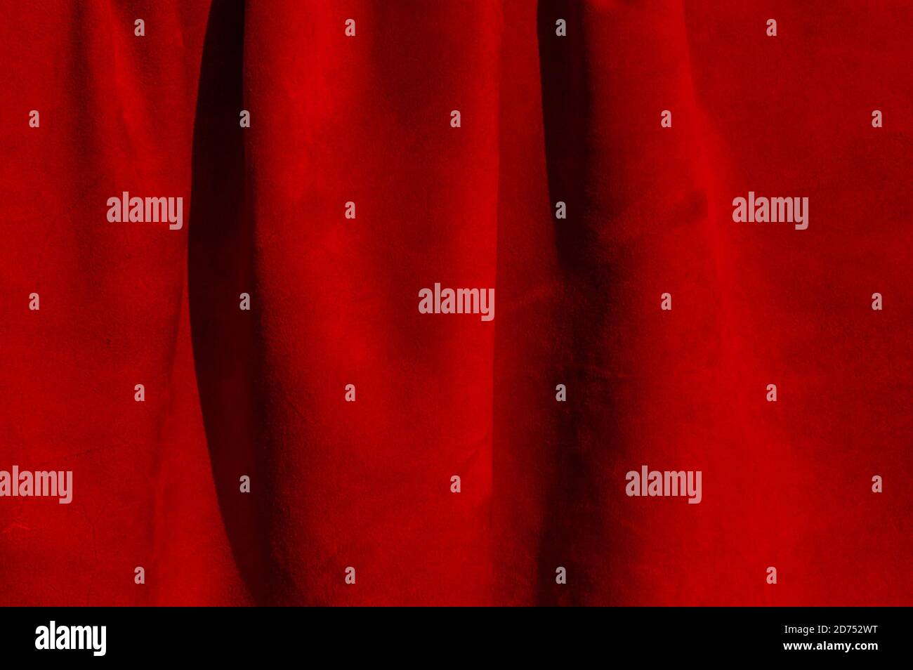 Red matte background of suede fabric, closeup. Velvet texture of ...
