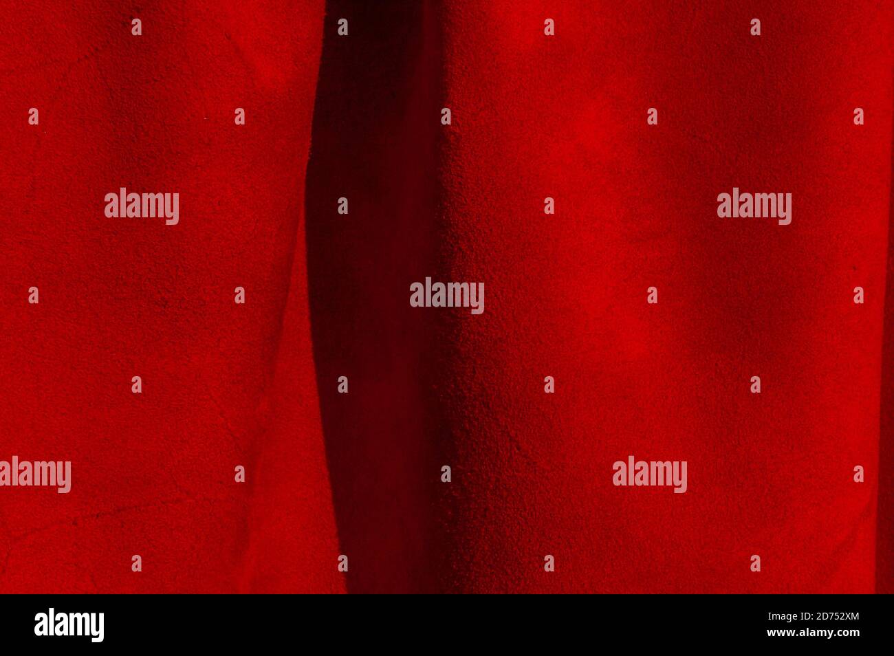 Red matte background of suede fabric, closeup. Velvet texture of ...