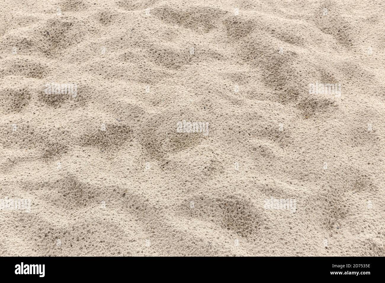 Sand background texture after rain. Wet Sandy beach Stock Photo - Alamy