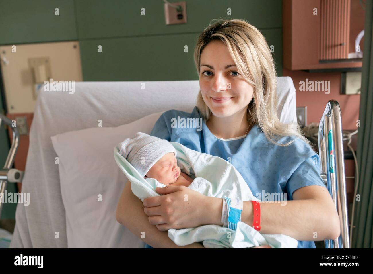 Mother with her newborn baby at the hospital a day after a natural ...