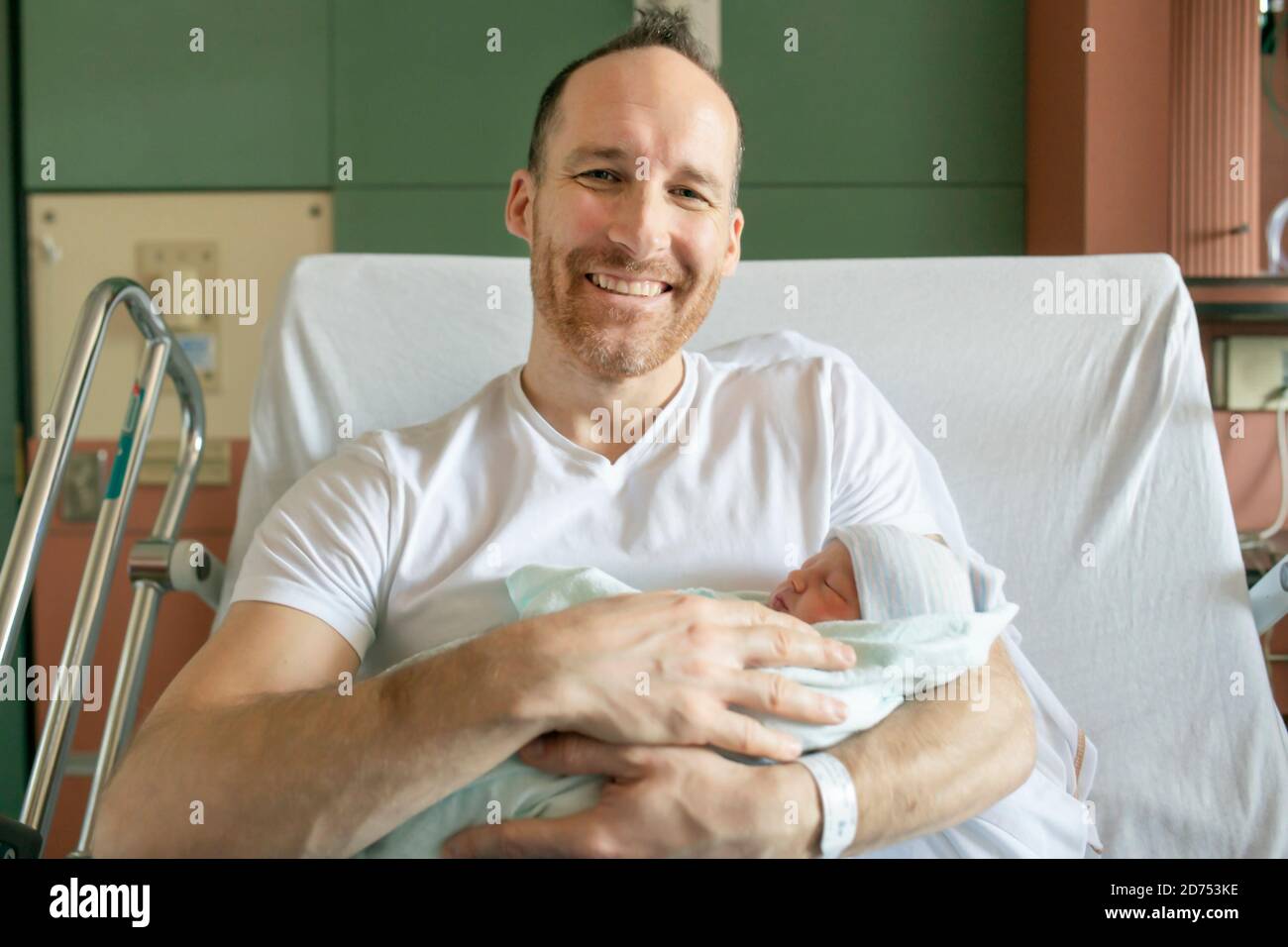 Father with her newborn baby at the hospital a day after birth Stock ...