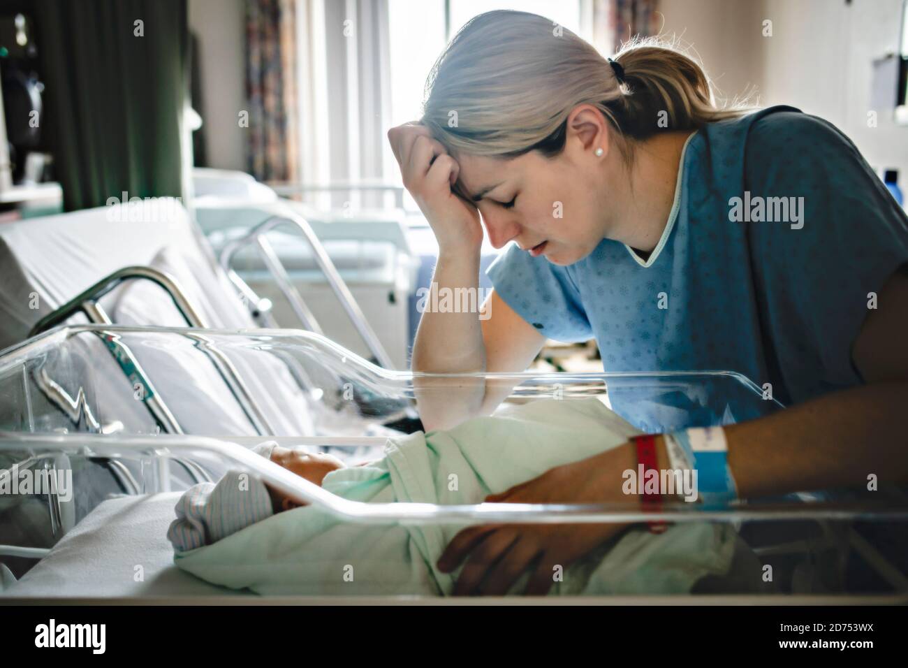 Sad woman newborn hospital bed hi-res stock photography and images - Alamy