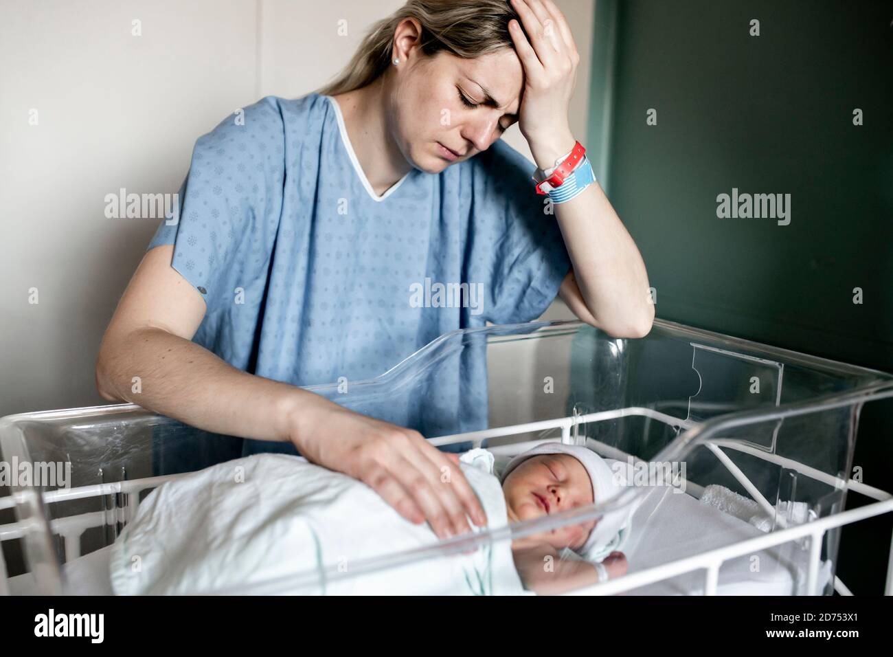 Sad and depress Mother with her newborn baby at the hospital a day ...