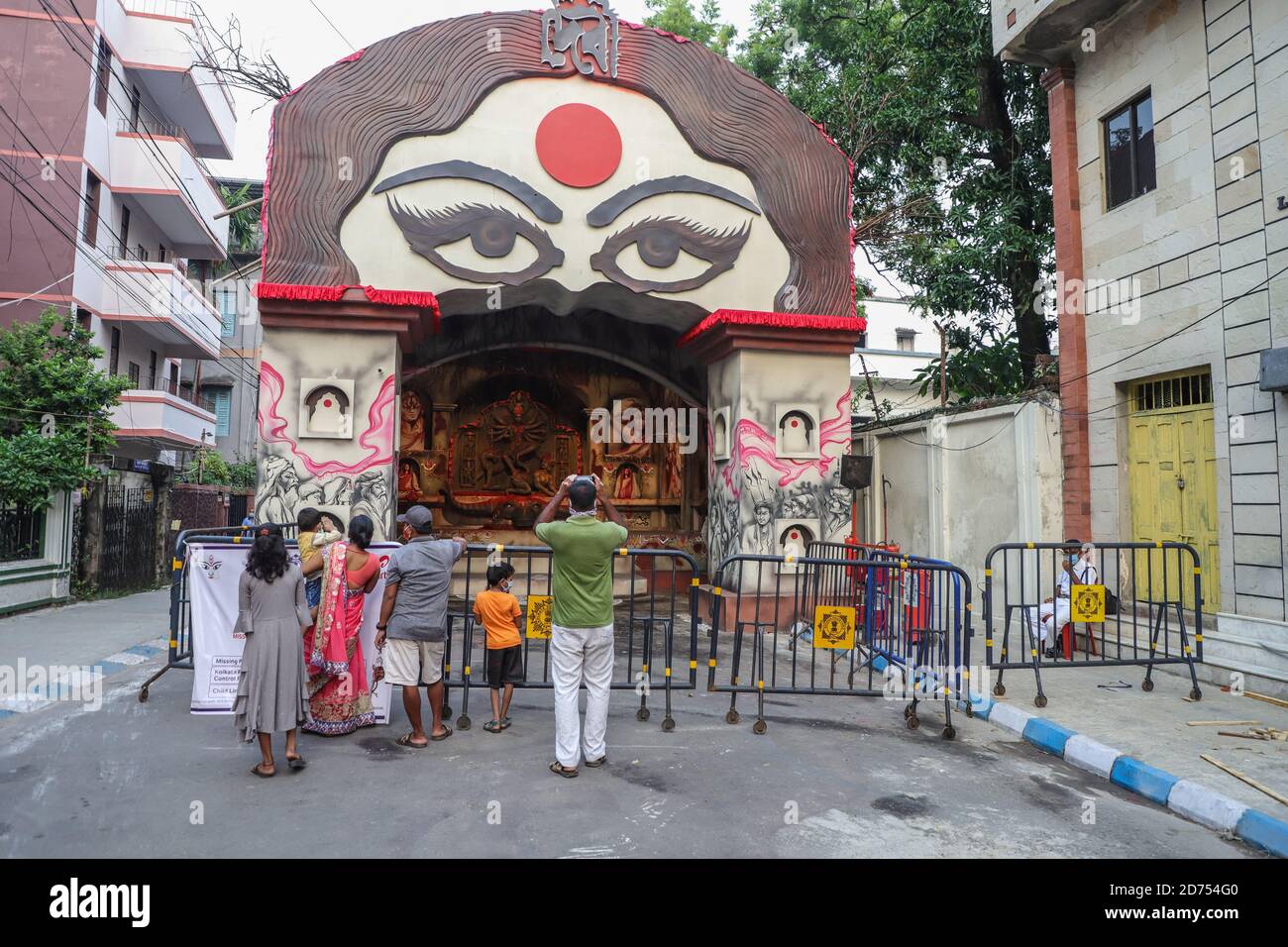 People take pictures of the idols of Goddess Durga from outside of the ...