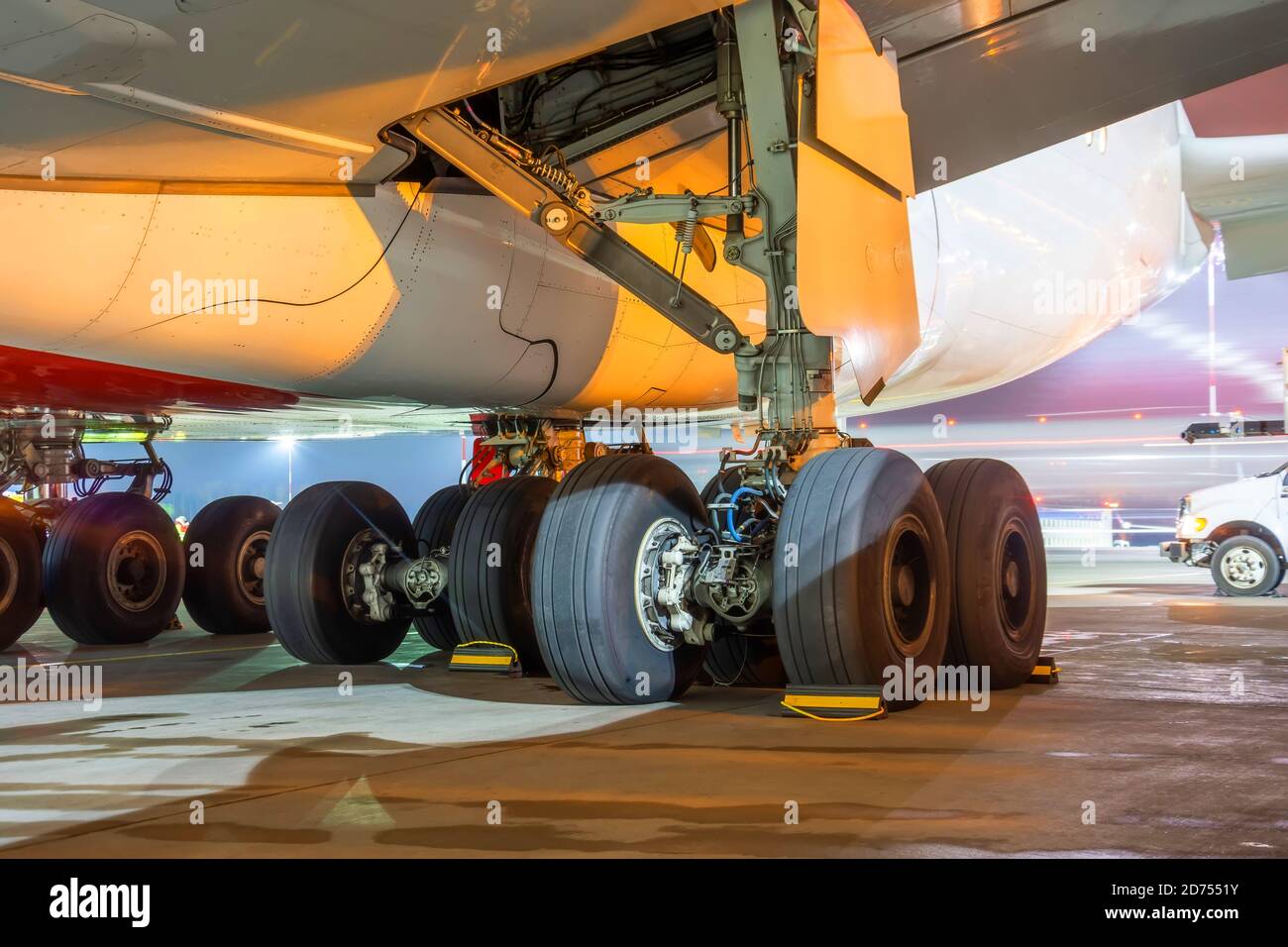 Group of main landing gear of a wide-body aircraft under the wing and ...