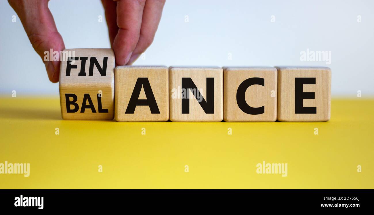 Symbol for finding the right balance in your finance. Hand turns a cube ...