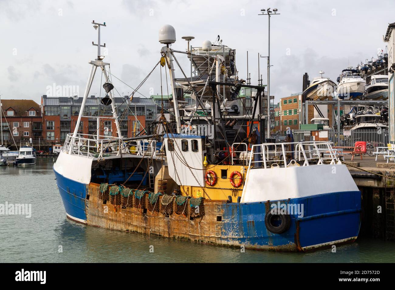 A large fishing trawler docked at a quay Stock Photo - Alamy