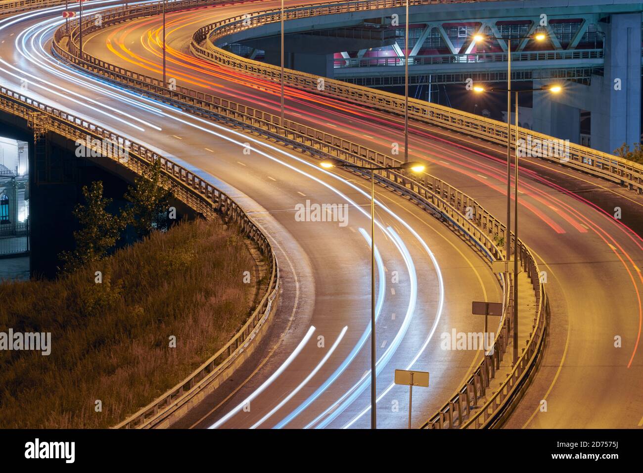 Highway at night lights. Fast car light path, trails and streaks on ...
