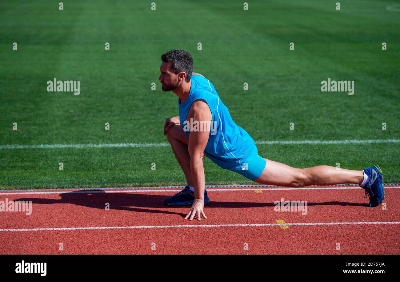 keep moving. sportsman relax. athlete train his flexibility. be ...