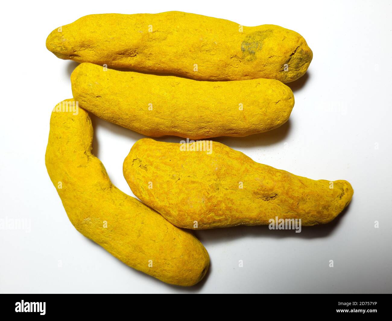 High angle shot of dried turmeric roots isolated on a white background ...