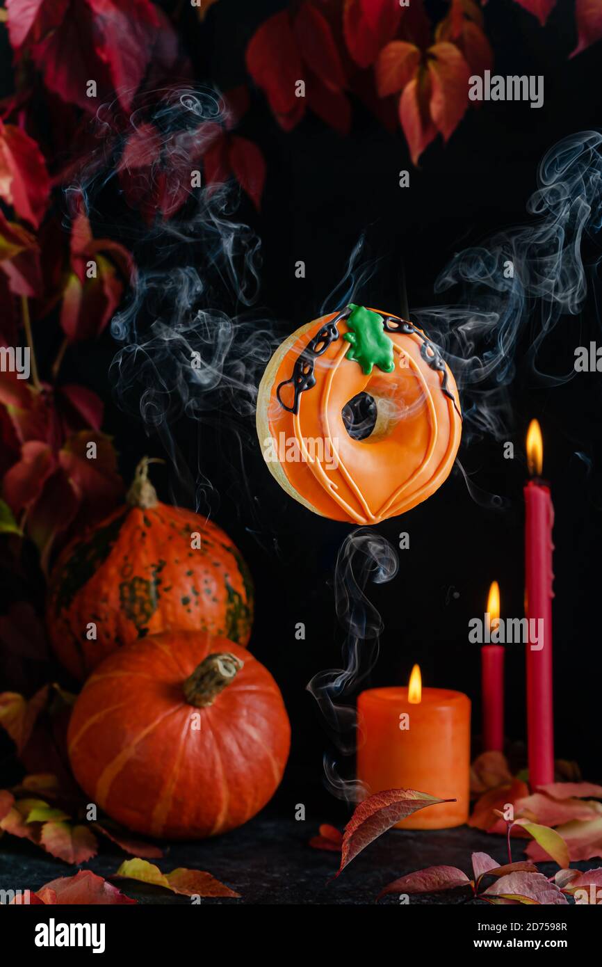 Flying pumpking donut on dark halloween background.Copy space Stock ...