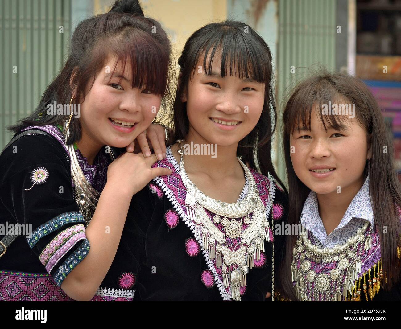 Three Vietnamese Hmong teenage girls wear their clan’s traditional ...