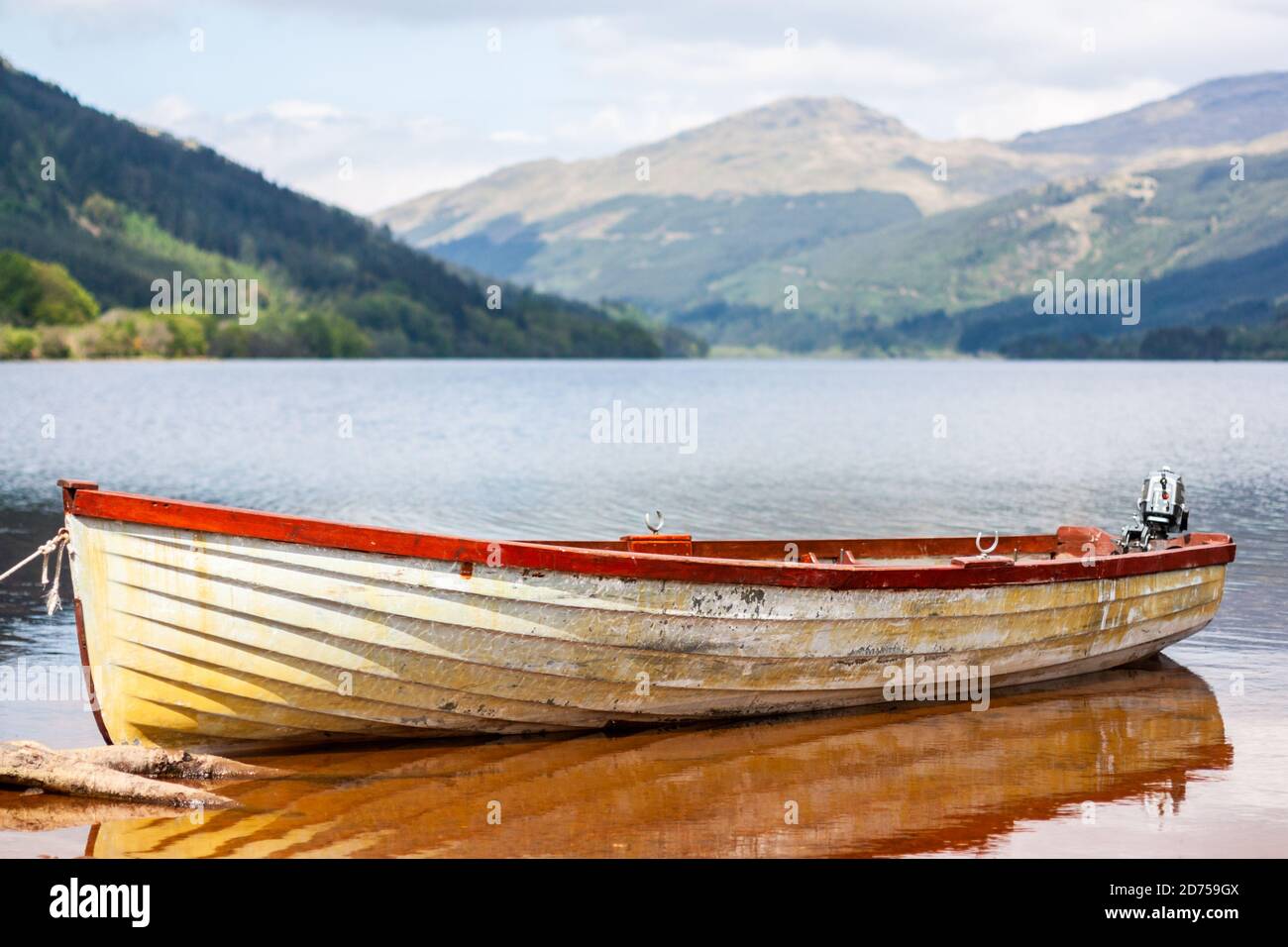 White and red clinker style boat on Loch Eck, Scotland UK May 2010 ...