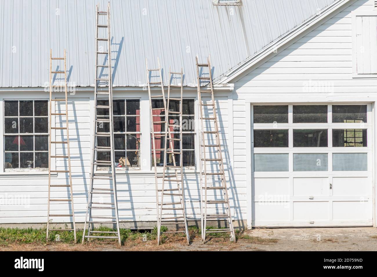 apple picking ladders leaning against a building in Vermont Stock Photo ...