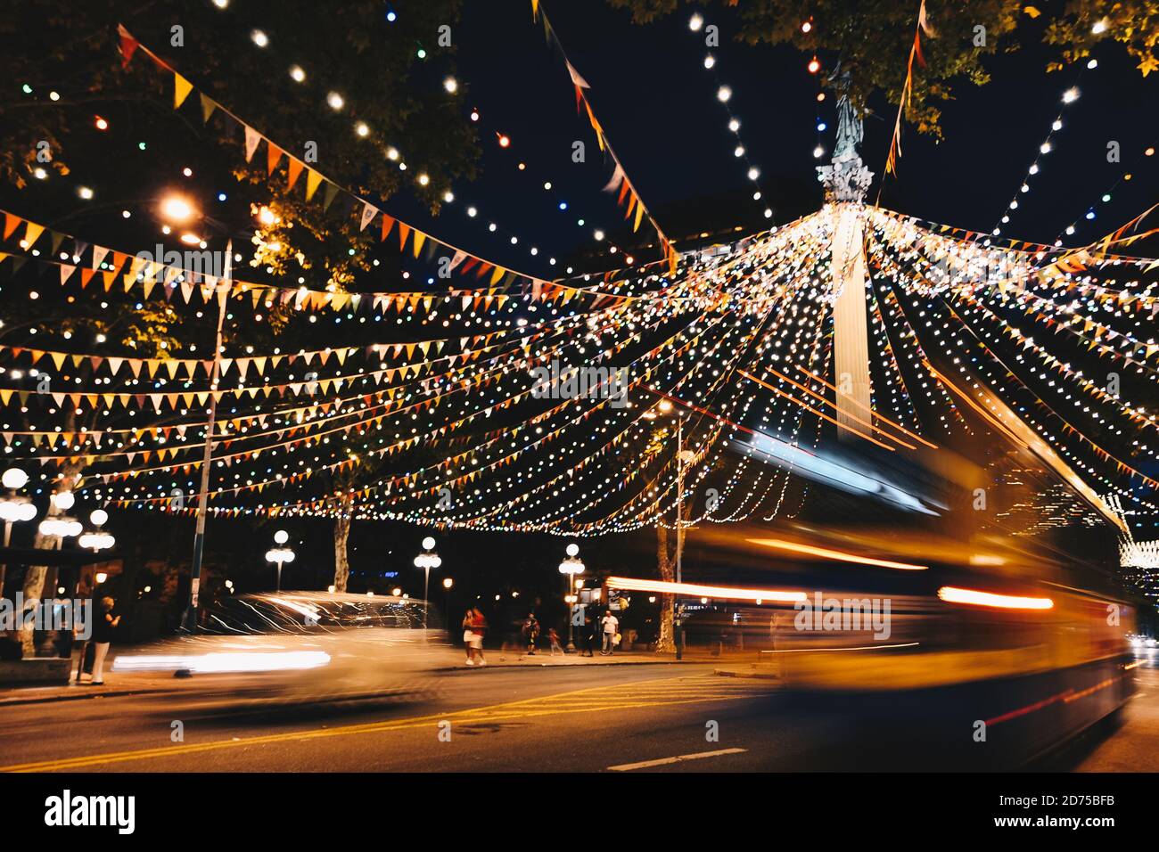 Colorful outdoor lights bulbs in a dark night Stock Photo - Alamy