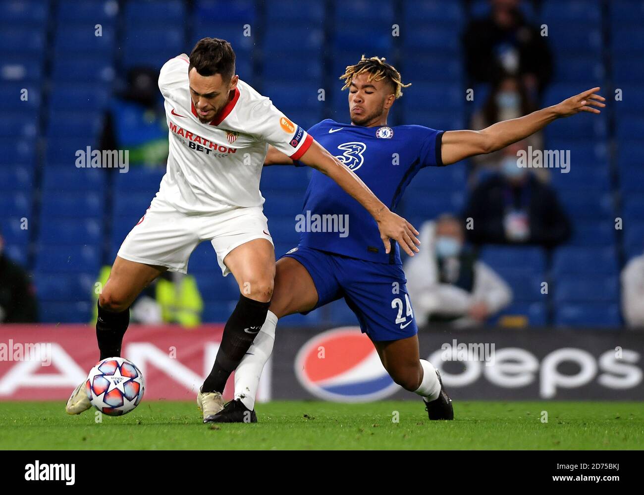 Sevilla's Lucas Ocampos and Chelsea’s Reece James (right) battle for ...