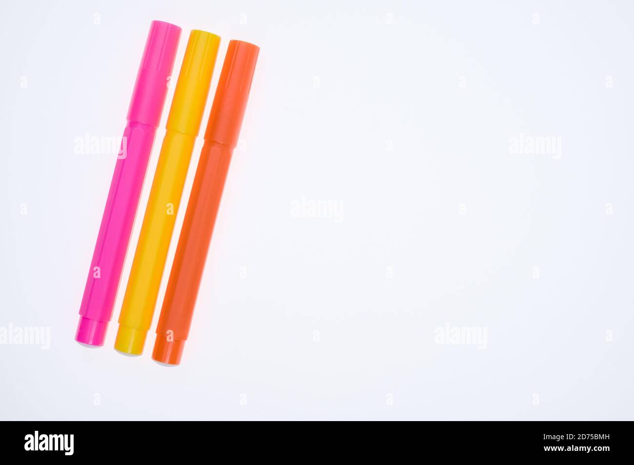 Closeup of three different color markers placed next to each other ...