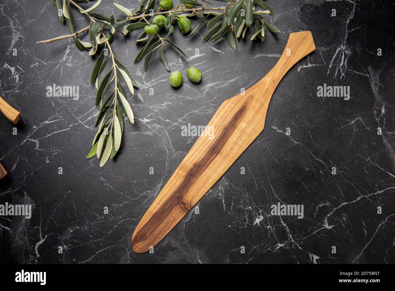 hand carved wooden kitchen tools on the table Stock Photo - Alamy