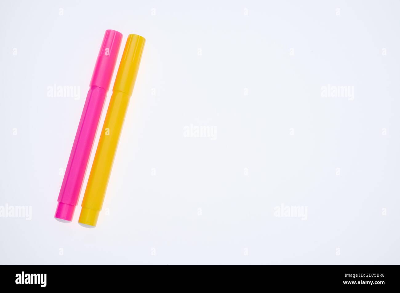 Closeup of two different color markers placed next to each other ...