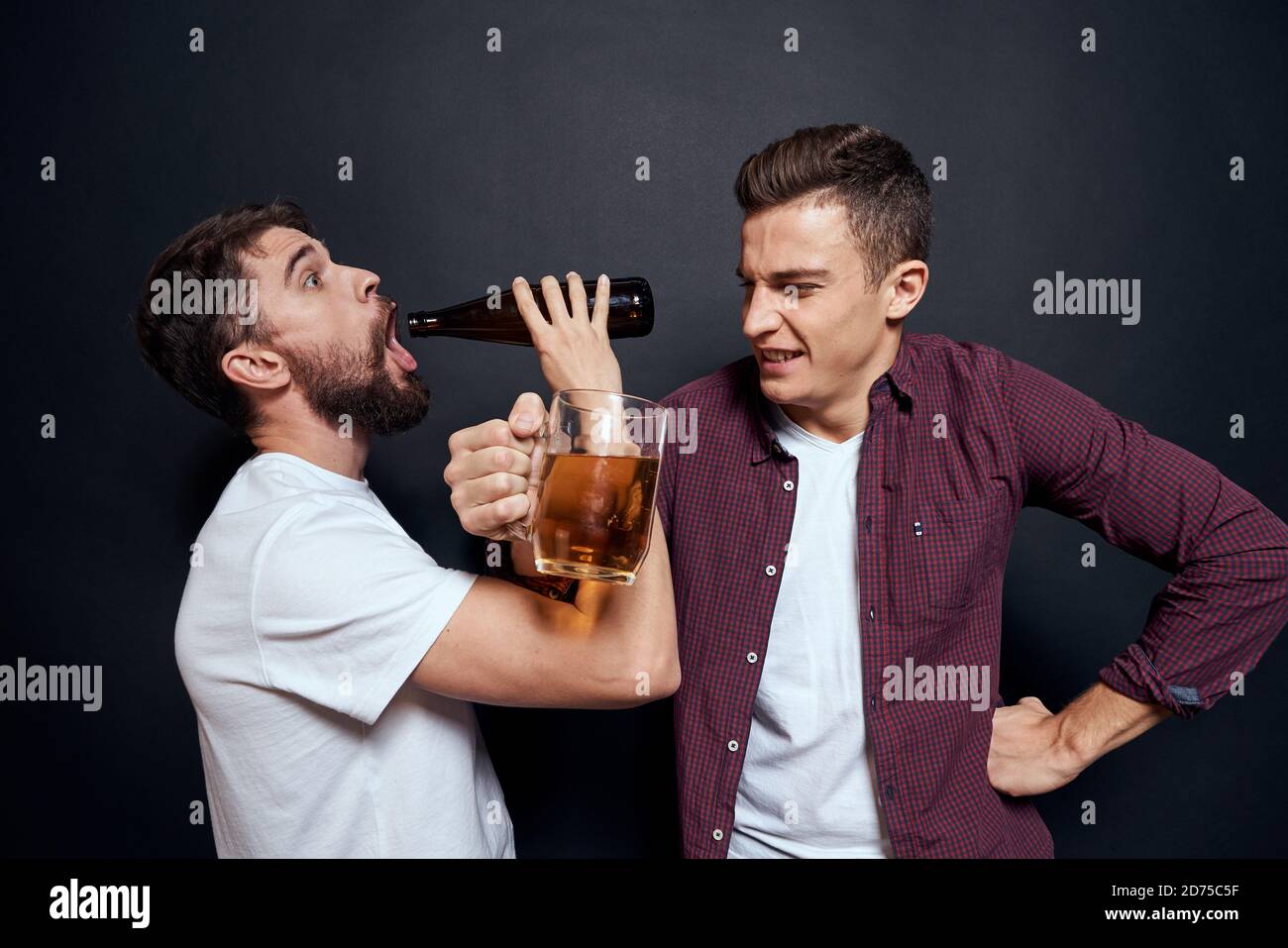 Two drunk friends drinking beer rest fun dark background Stock Photo ...