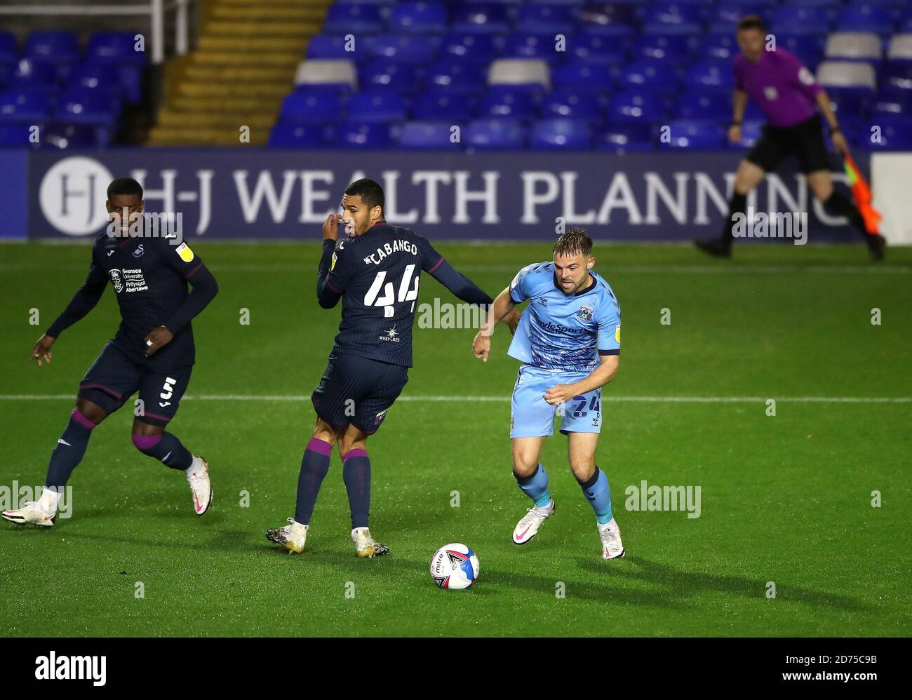 Coventry City's Matt Godden (centre) goes past Swansea City's Ben ...