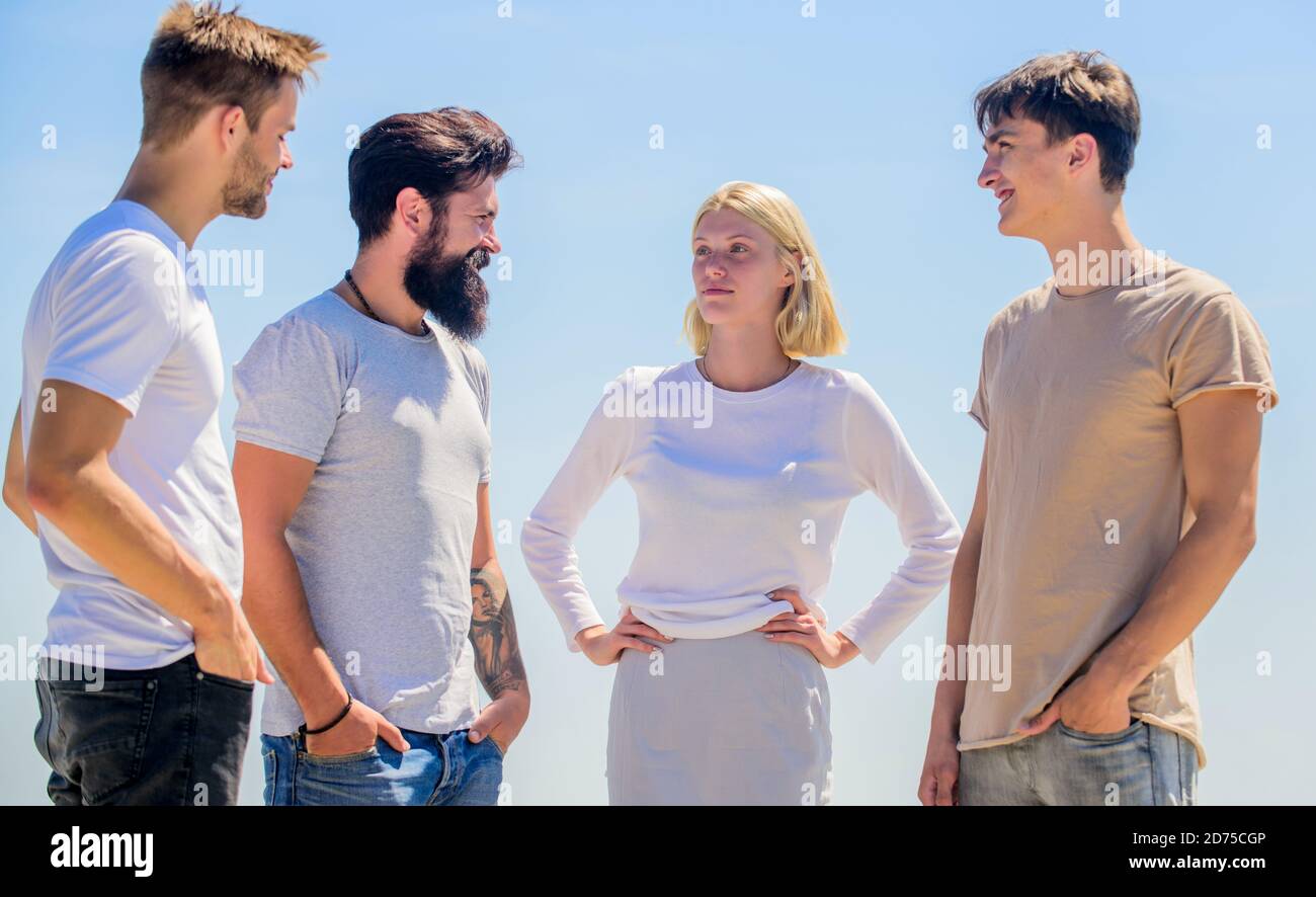 success is never easy. cheerful guys and girl. group of four people ...