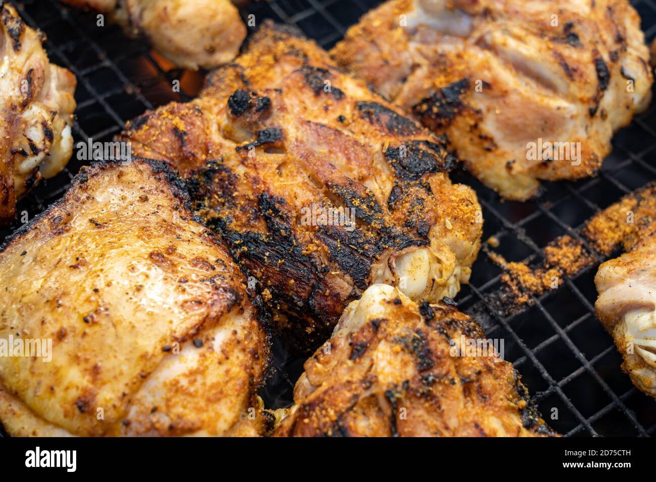Making BBQ chicken on a wood fired grill in the outdoors Stock Photo ...