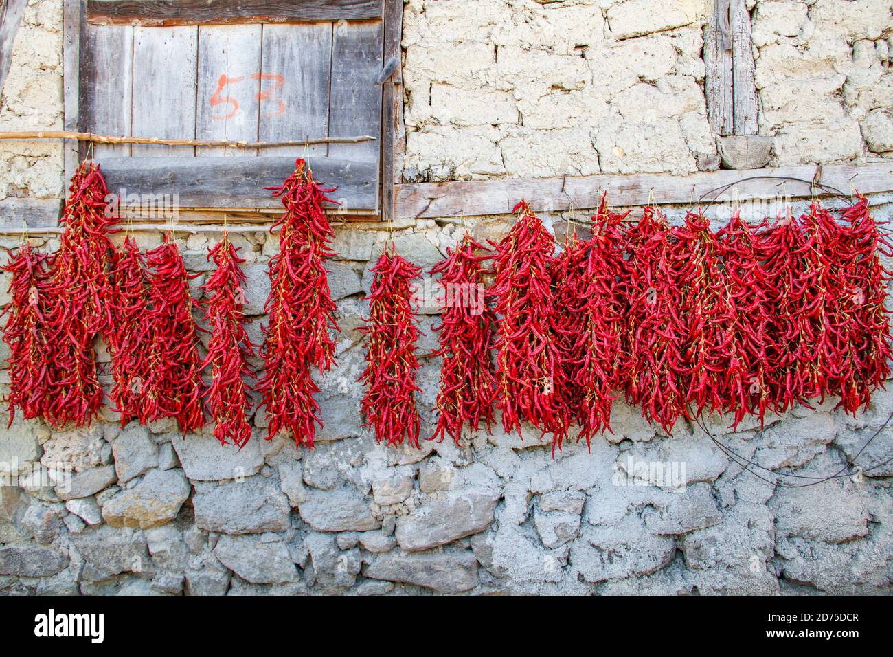 peppers drying outside as traditional Stock Photo - Alamy